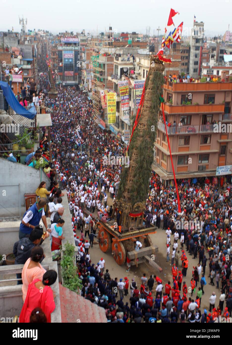 People participate in the chariot procession of Rato Machhendranath ...