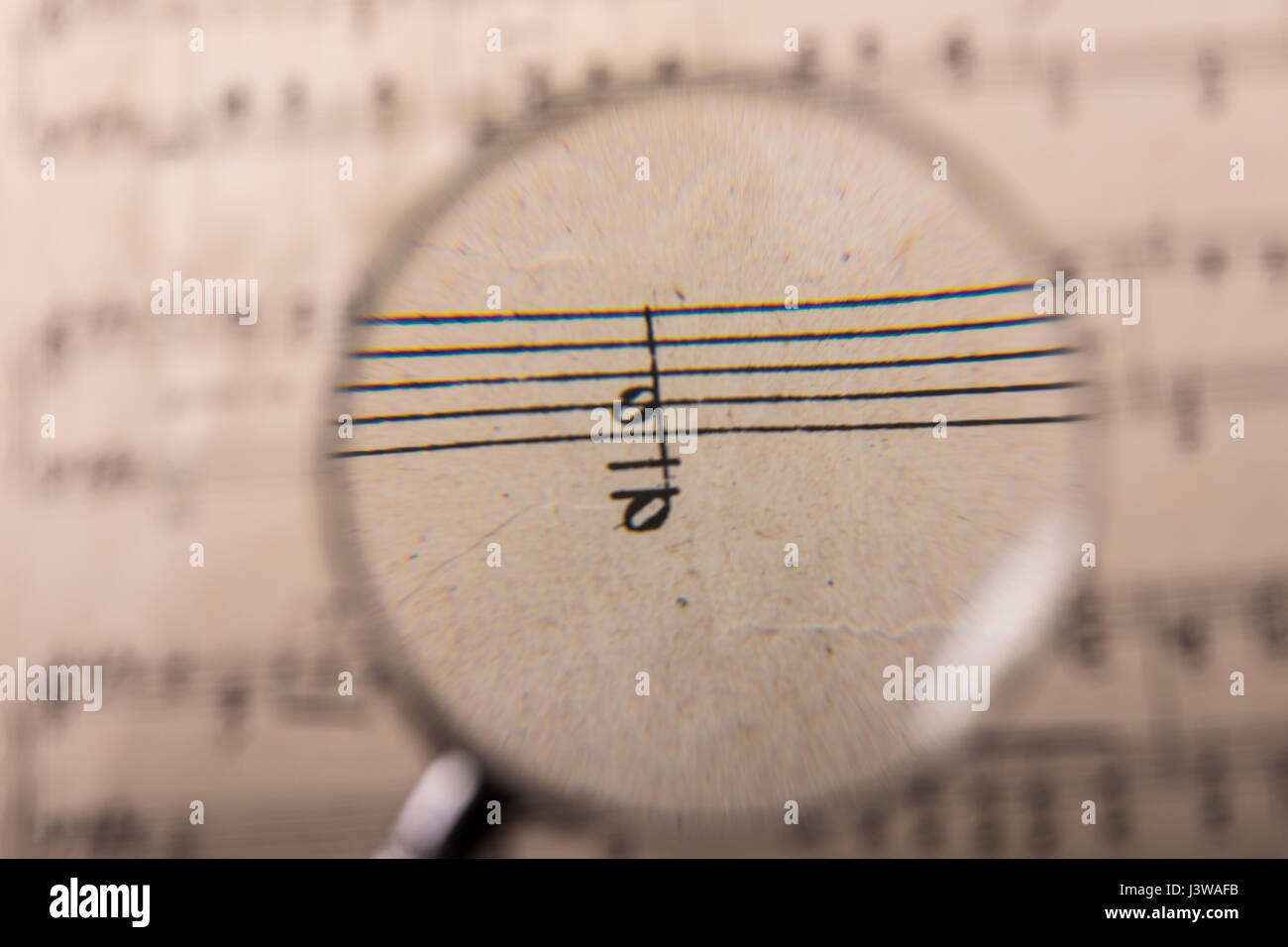 a view of the notes in a music score with a magnifier glass Stock Photo ...