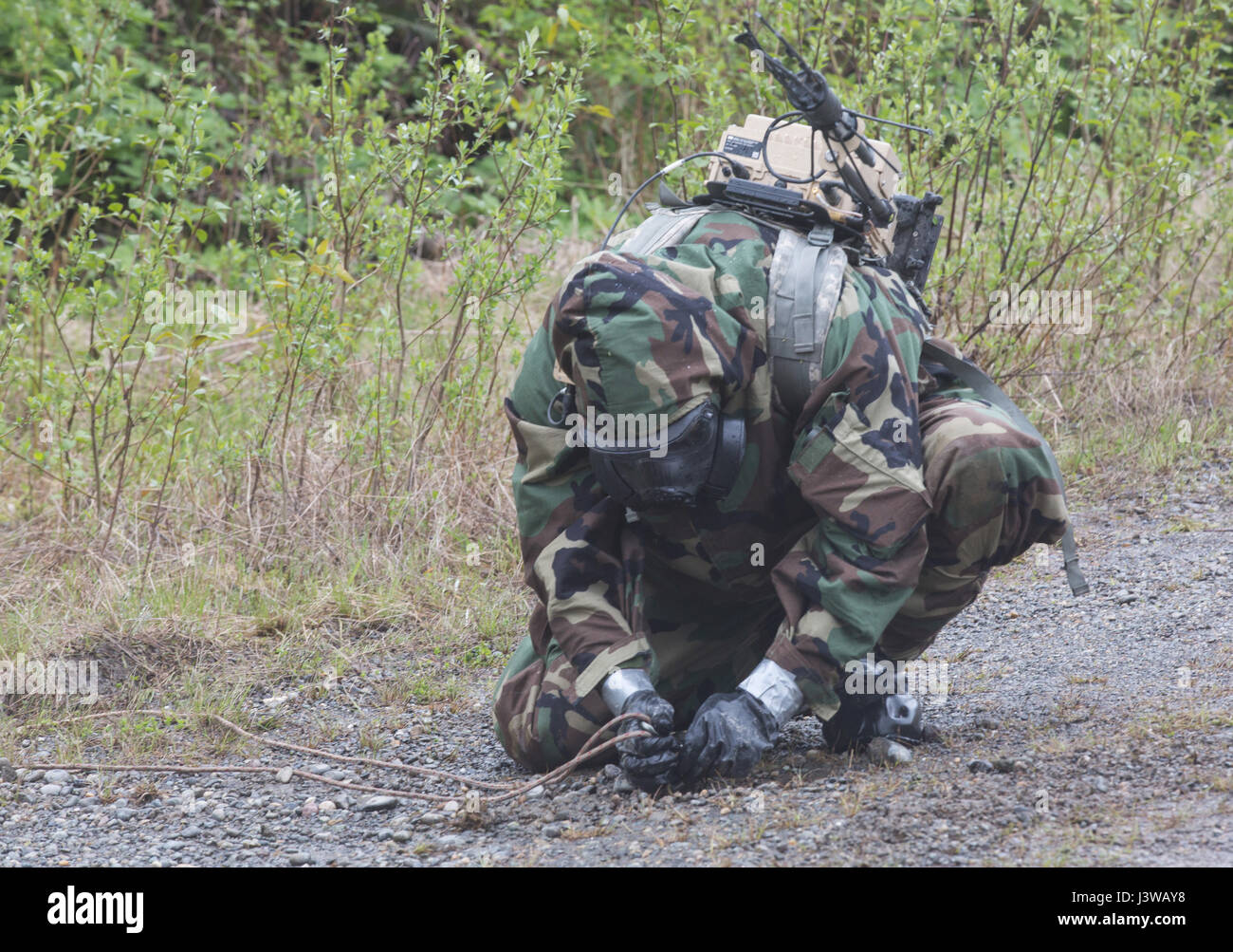 A U.S. Soldier from the 53rd Ordnance Company (EOD) neutralizes an ...