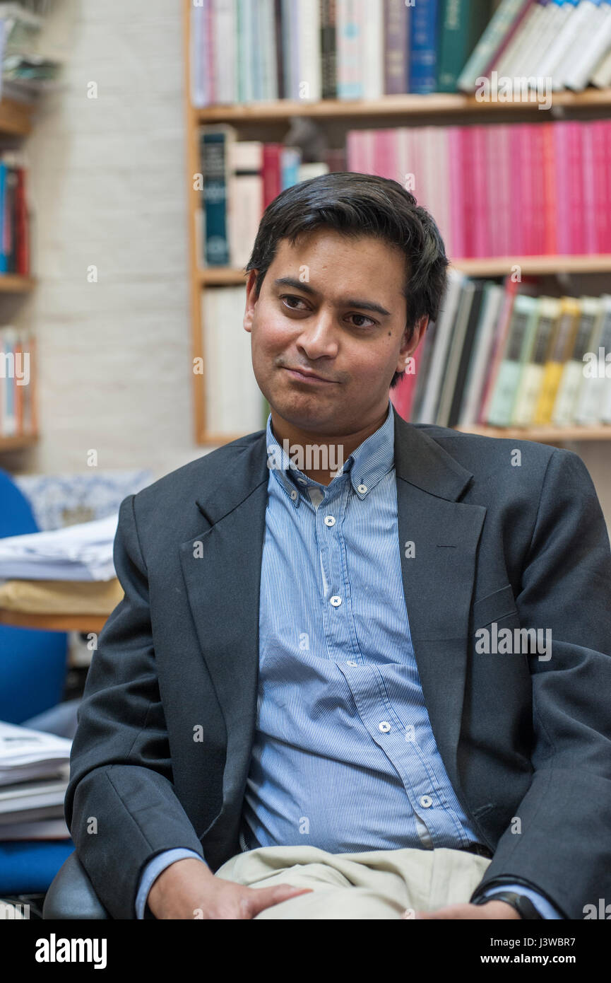 Rana Mitter surrounded by books at Oxford University Stock Photo - Alamy