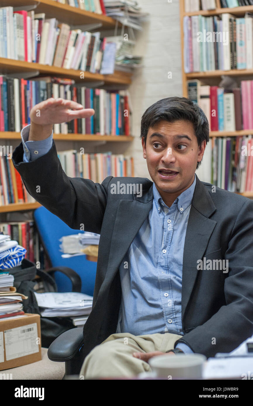 Rana Mitter surrounded by books at Oxford University Stock Photo - Alamy