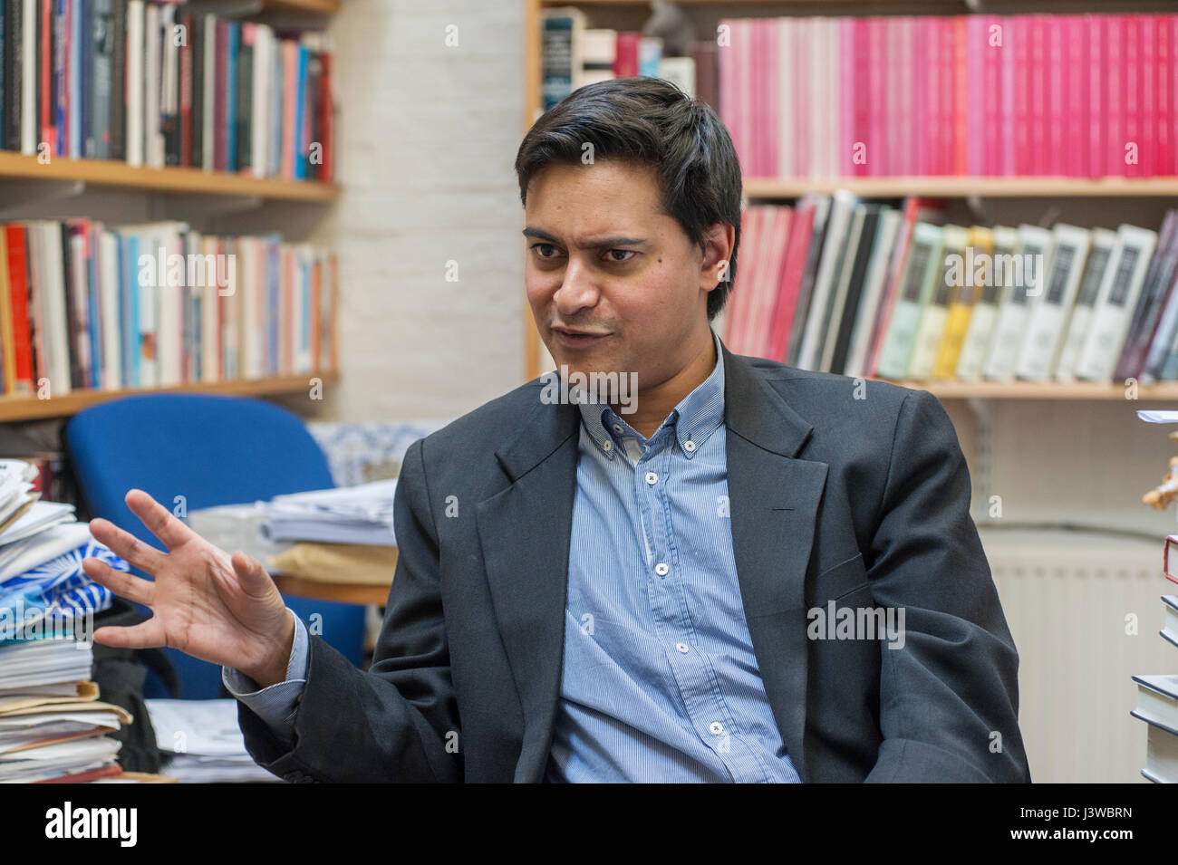 Rana Mitter surrounded by books at Oxford University Stock Photo - Alamy