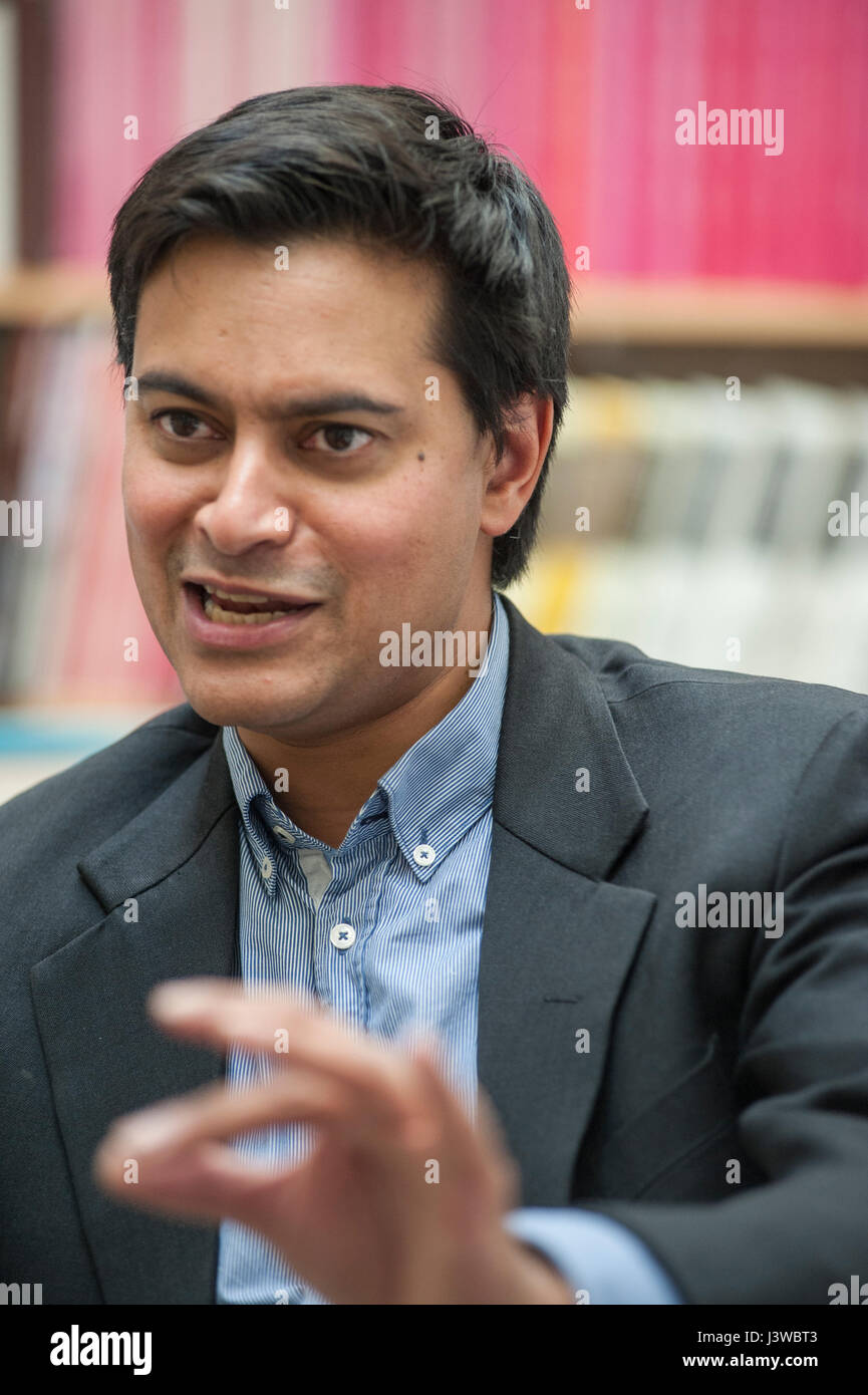 Rana Mitter surrounded by books at Oxford University Stock Photo - Alamy