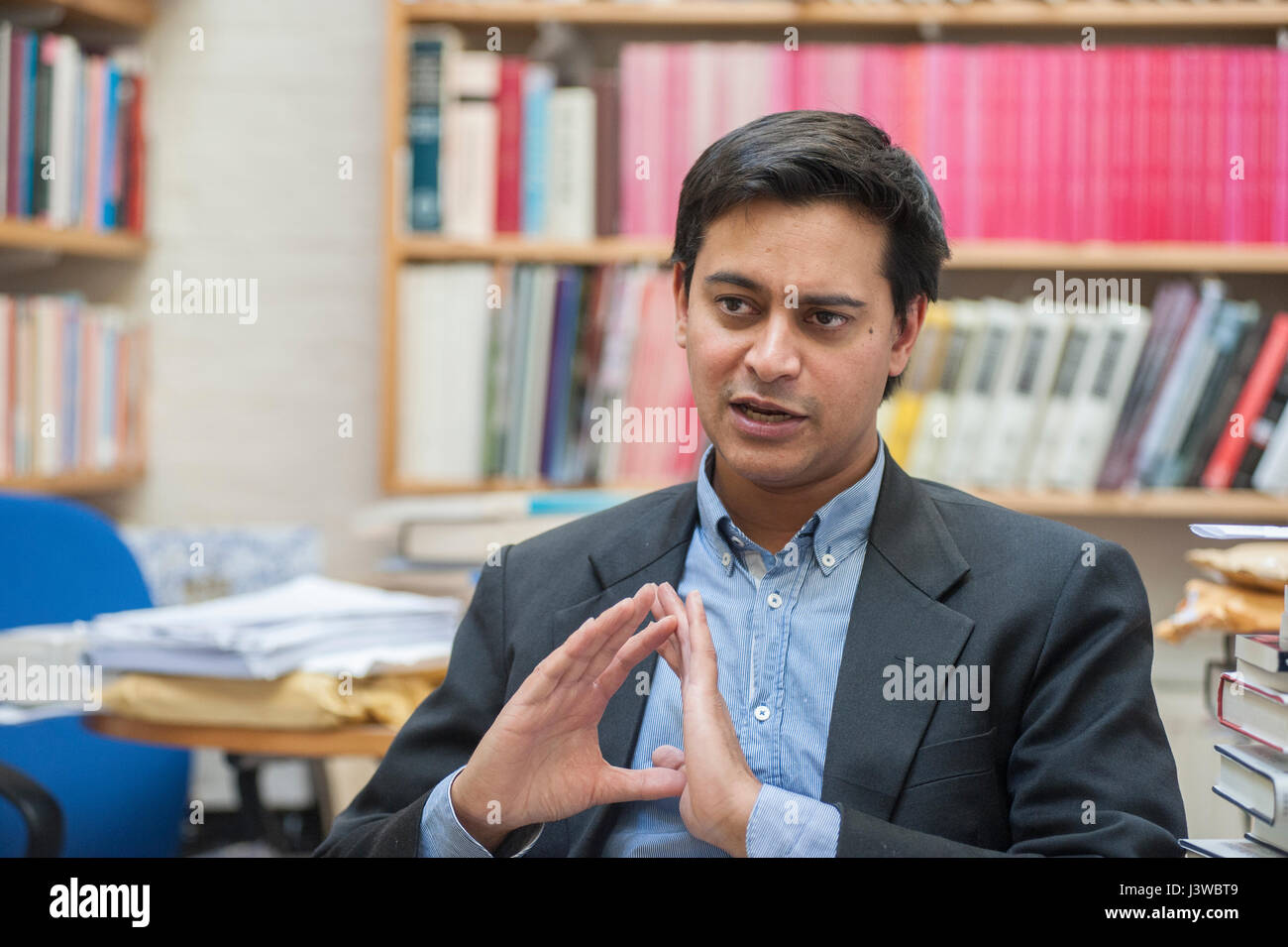 Rana Mitter surrounded by books at Oxford University Stock Photo - Alamy
