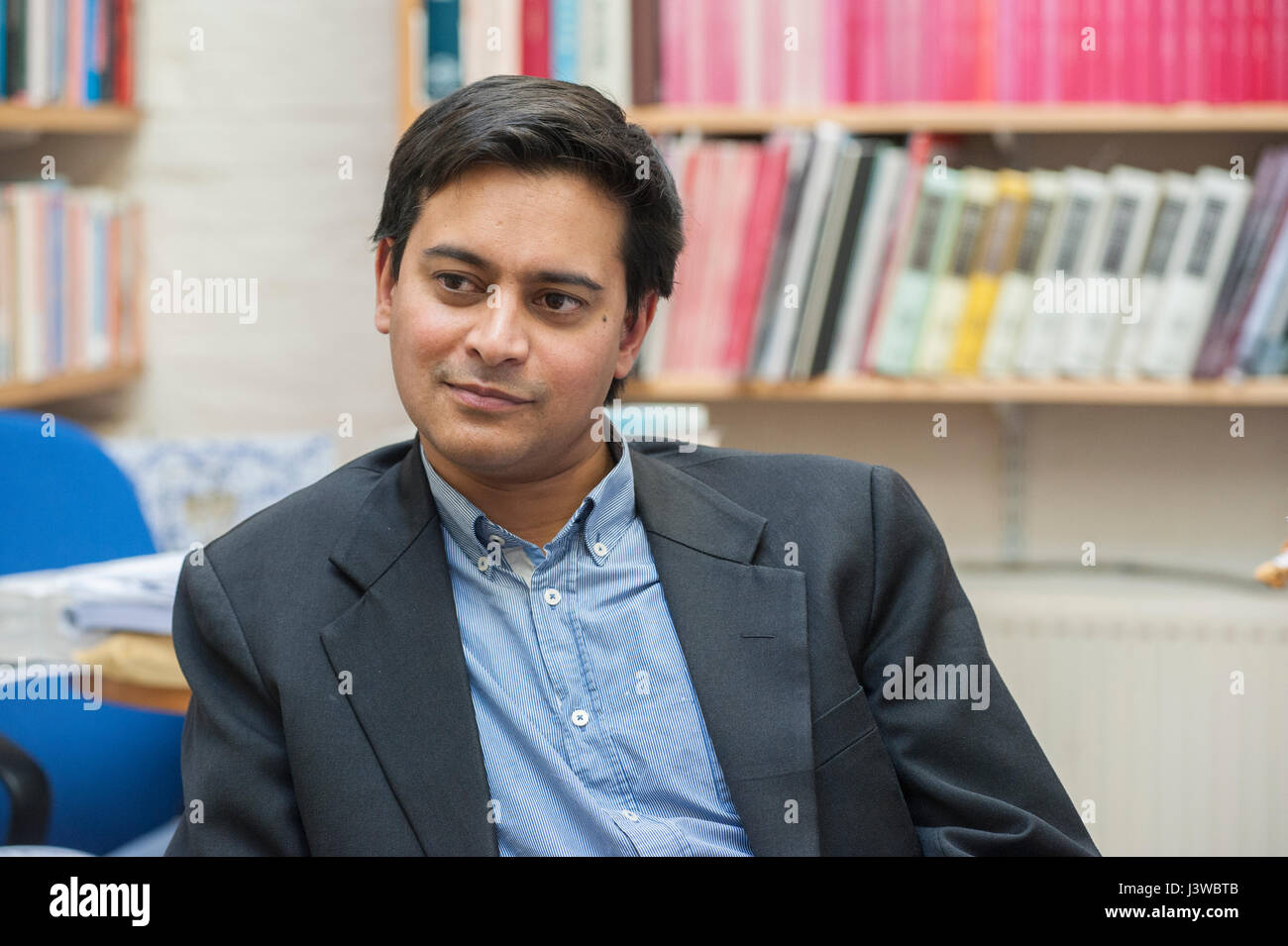 Rana Mitter surrounded by books at Oxford University Stock Photo - Alamy