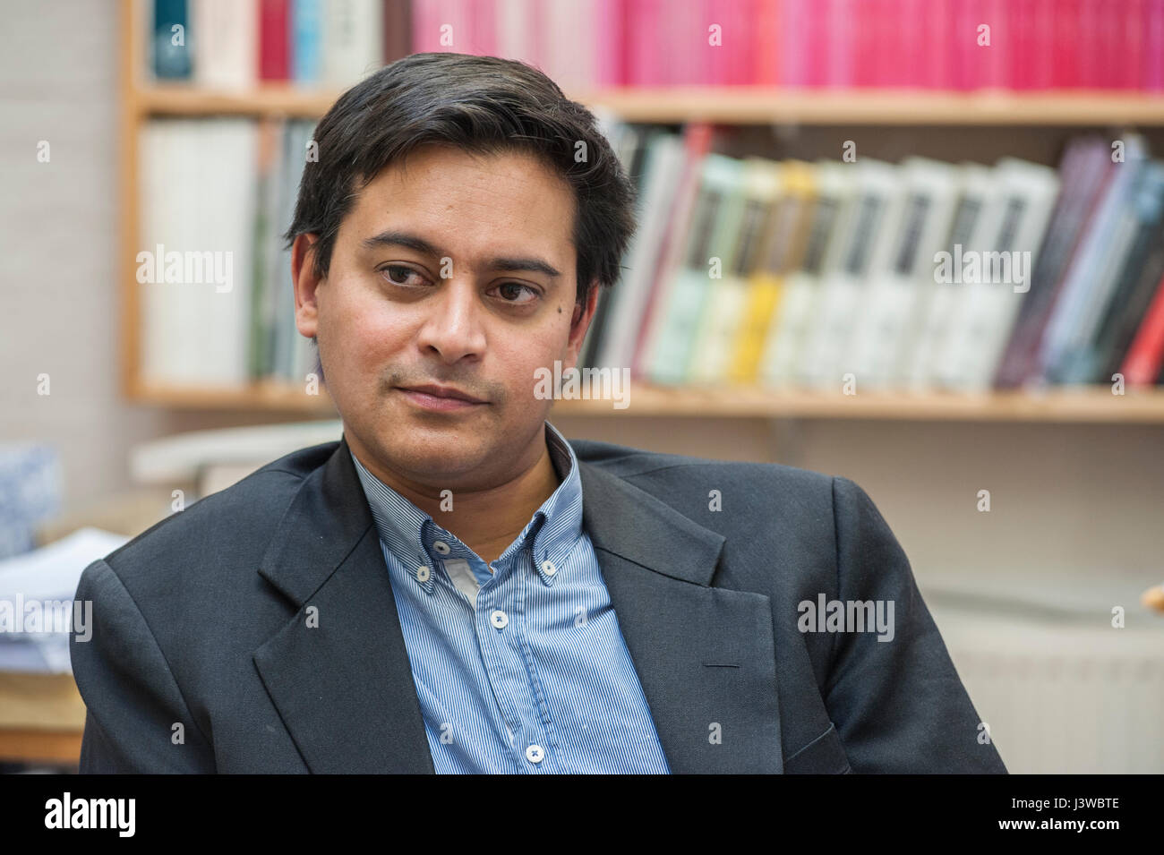 Rana Mitter surrounded by books at Oxford University Stock Photo - Alamy
