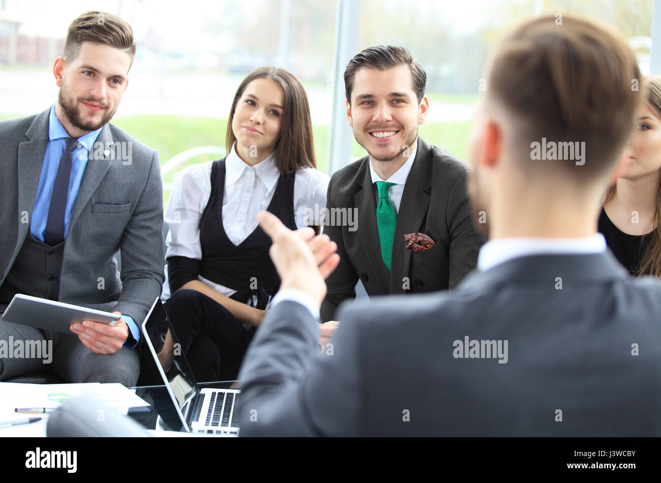 Business team discussing together business plans in office Stock Photo ...