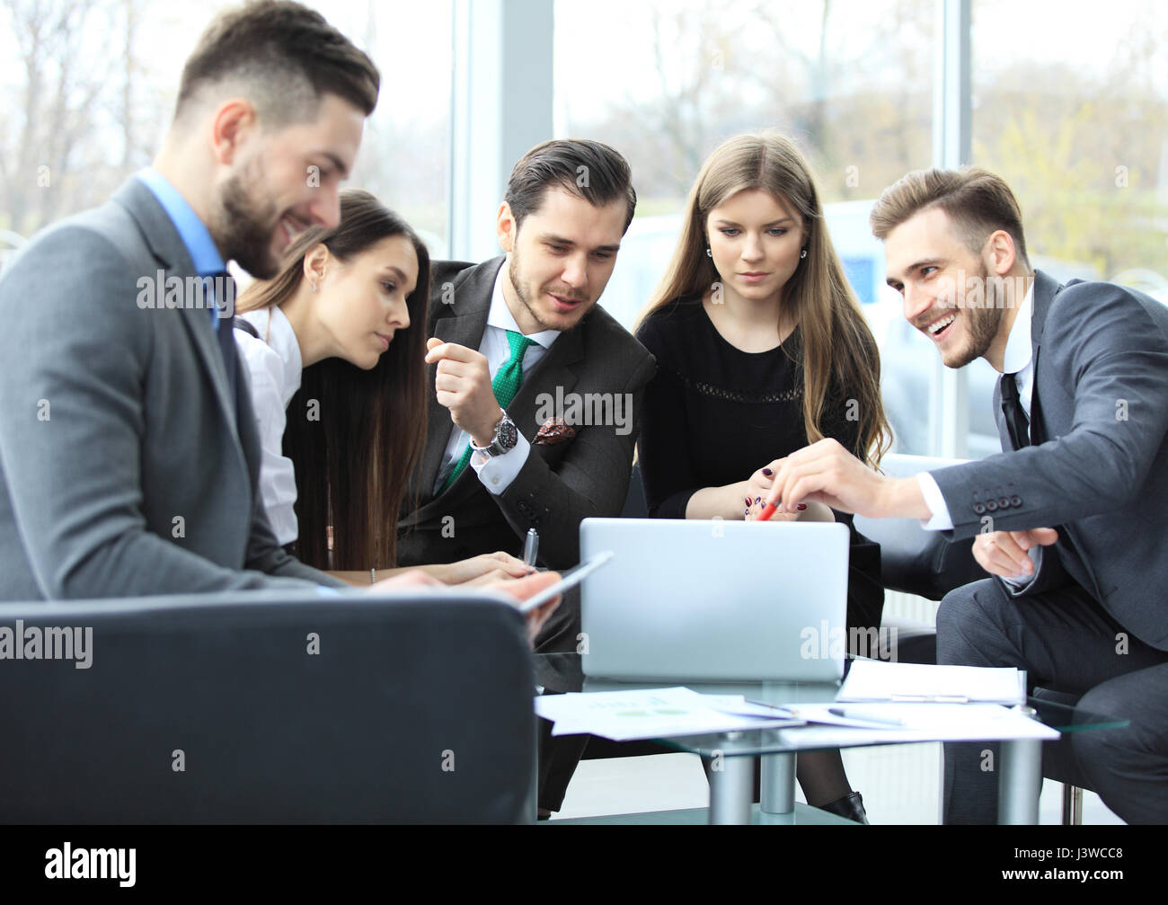 Business team discussing together business plans in office Stock Photo ...