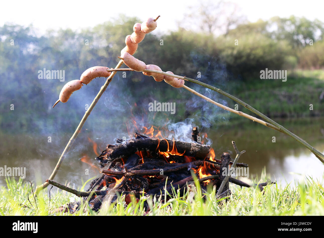 Sausage stick fire Stock Photo - Alamy
