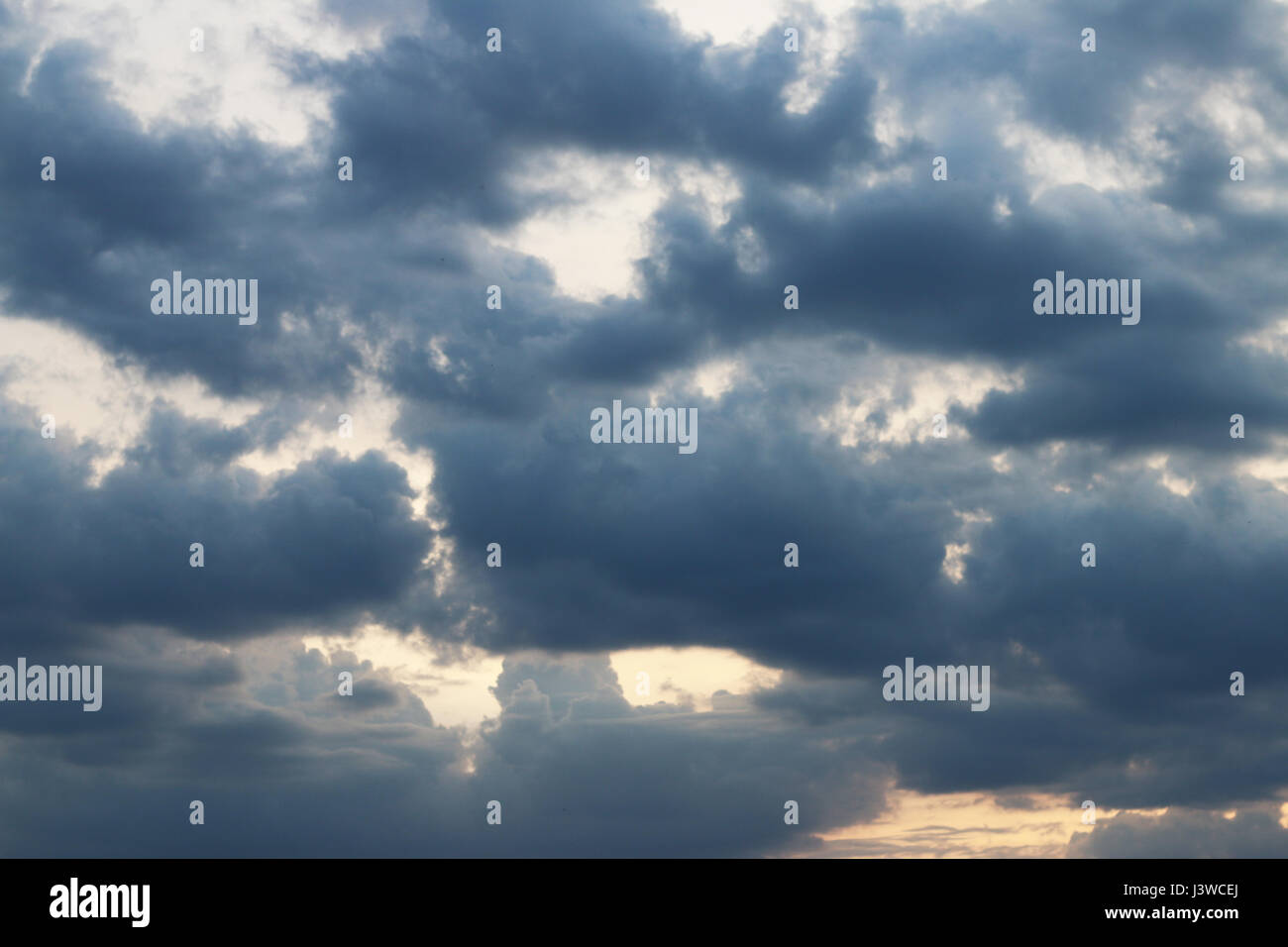 Sunset and dark clouds Stock Photo - Alamy