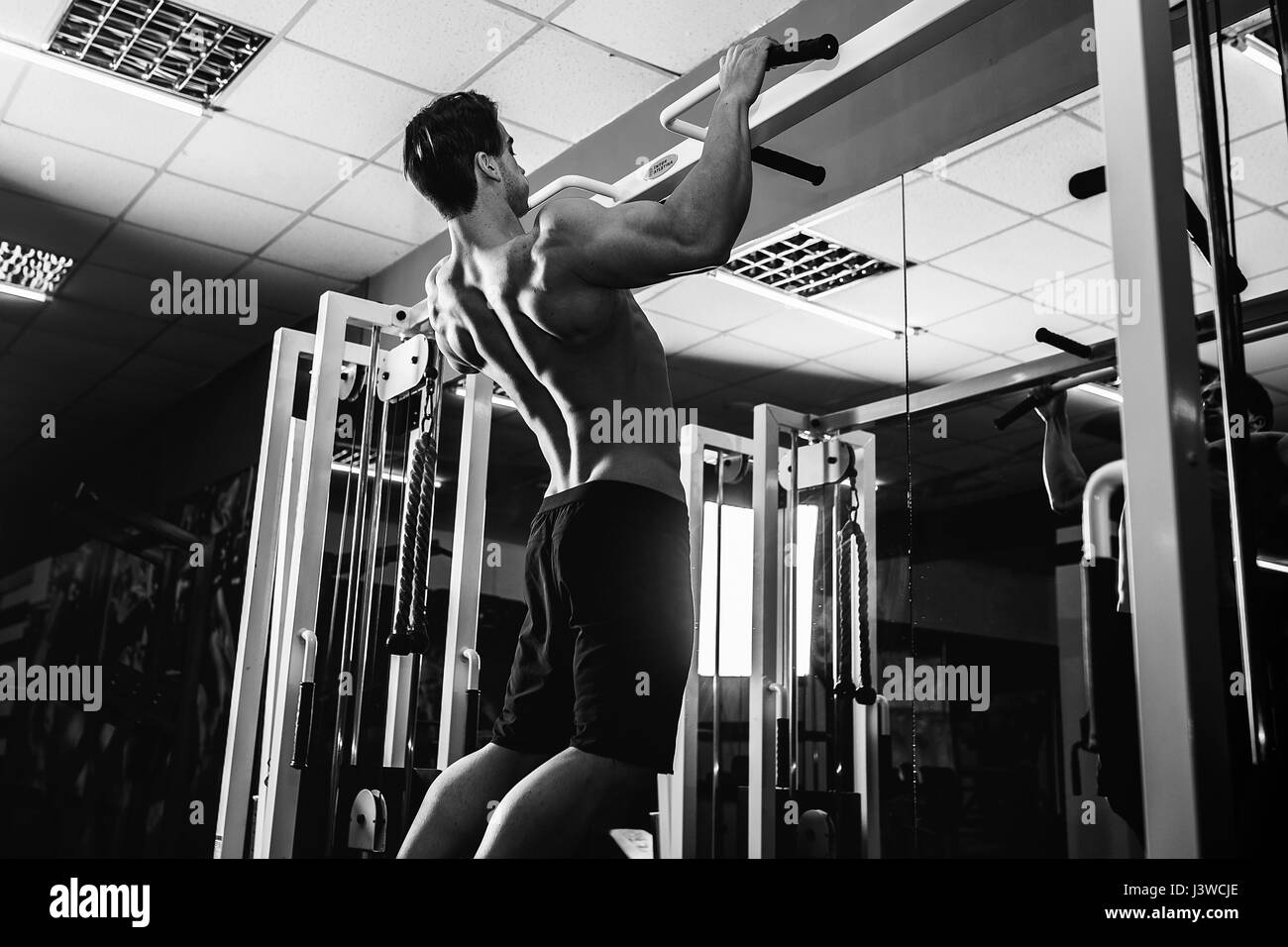 Strong man exercising in Black and White Stock Photos & Images - Alamy