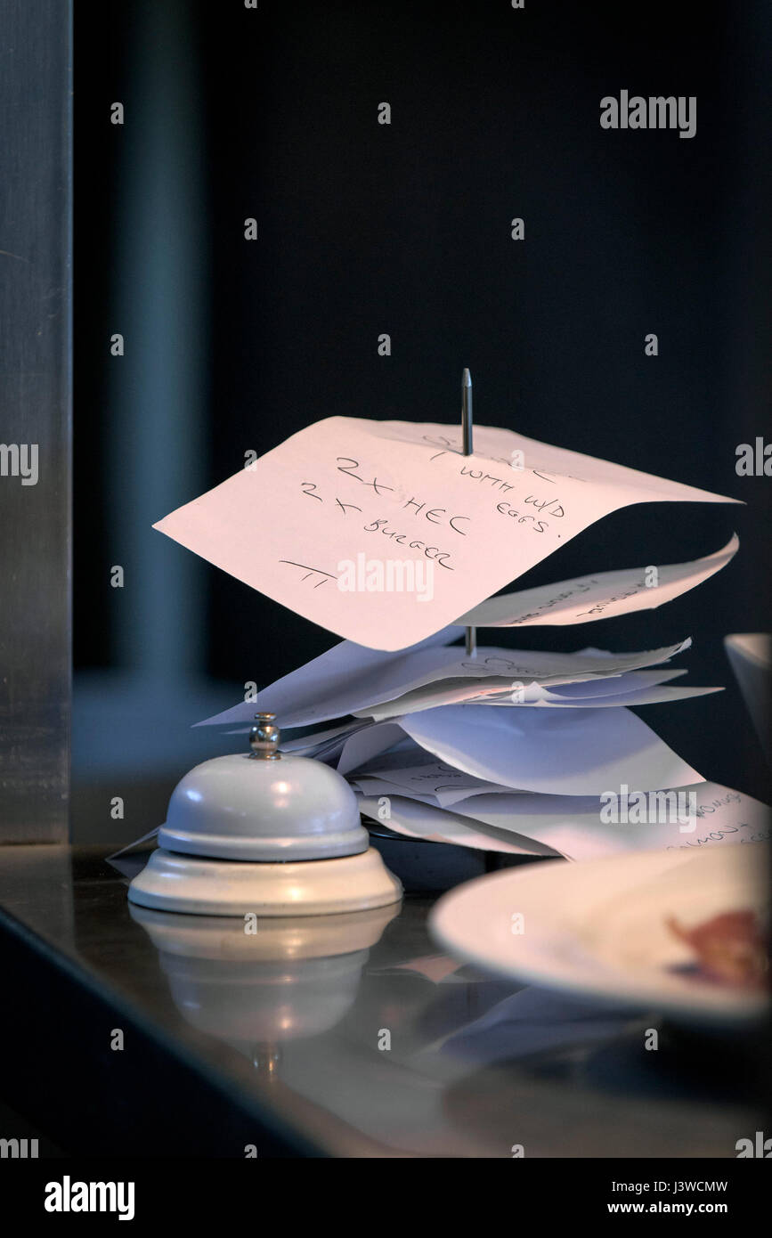 Written food orders on a spike Restaurant Kitchen Food industry Stock ...