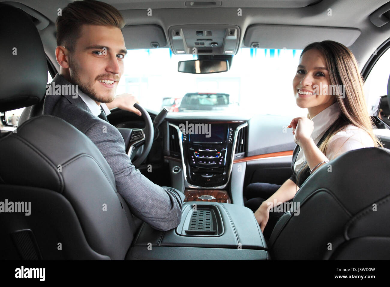 Portrait of an handsome guy driving his car Stock Photo - Alamy