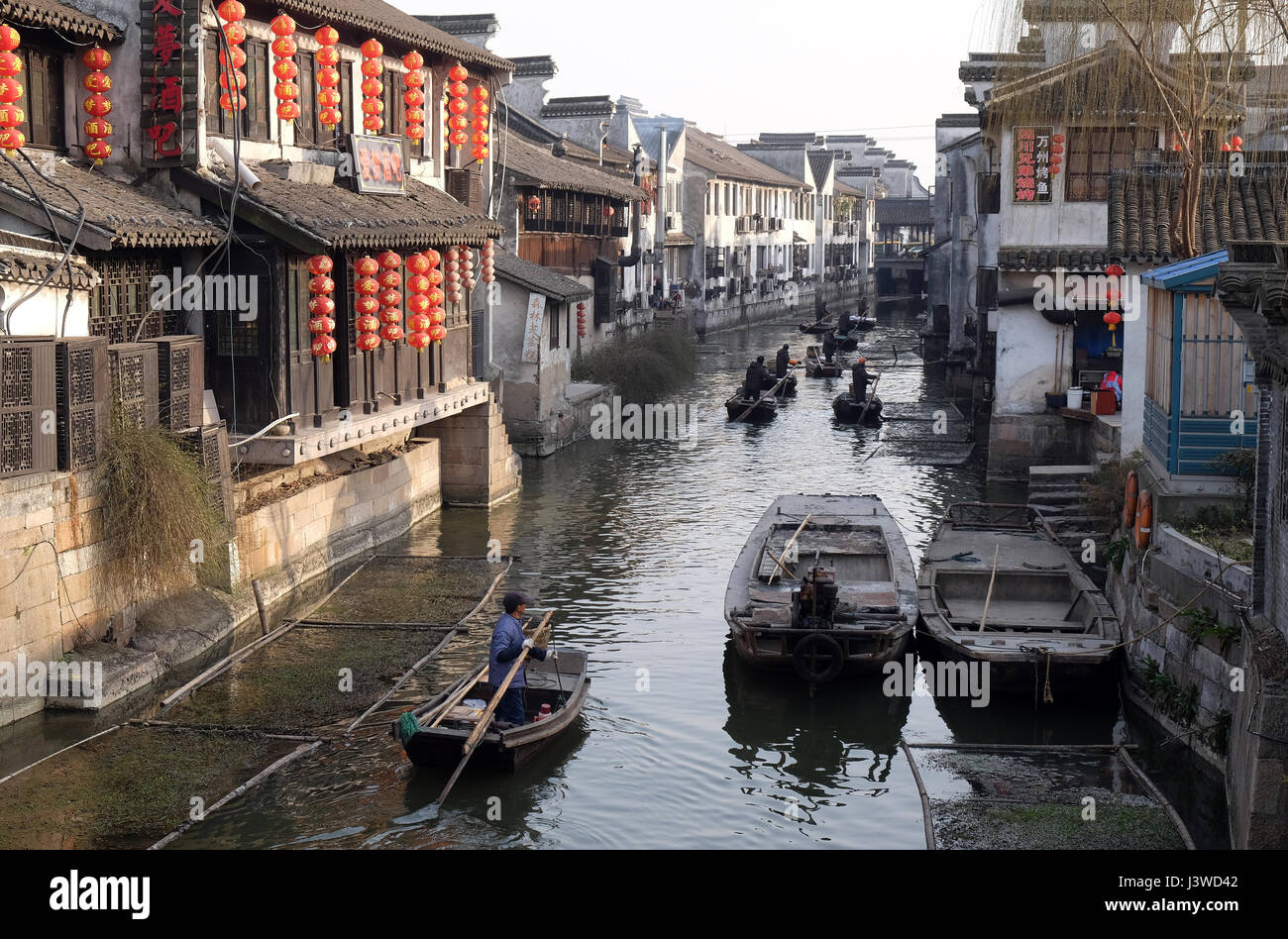 Tourist boats on the water canals of Xitang Town in Zhejiang Province ...