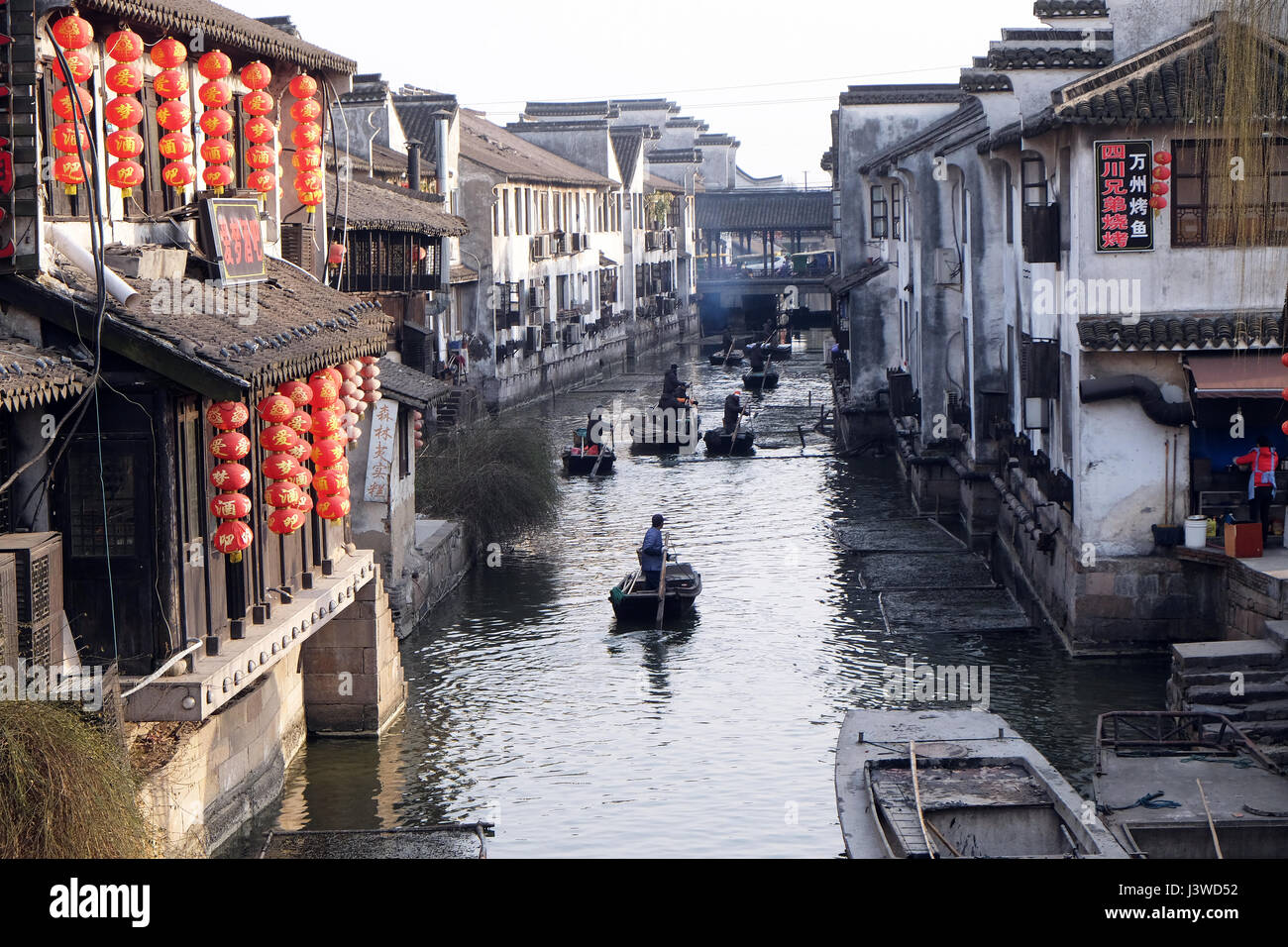 Tourist boats on the water canals of Xitang Town in Zhejiang Province ...