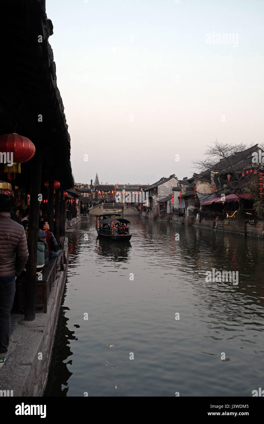 Tourist boats on the water canals of Xitang Town in Zhejiang Province ...