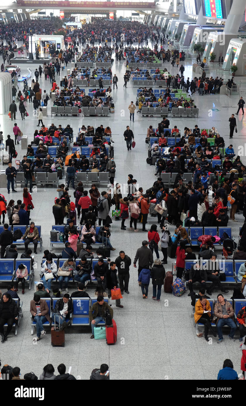 Passengers waiting for the train in the hall. Hangzhou East railway ...