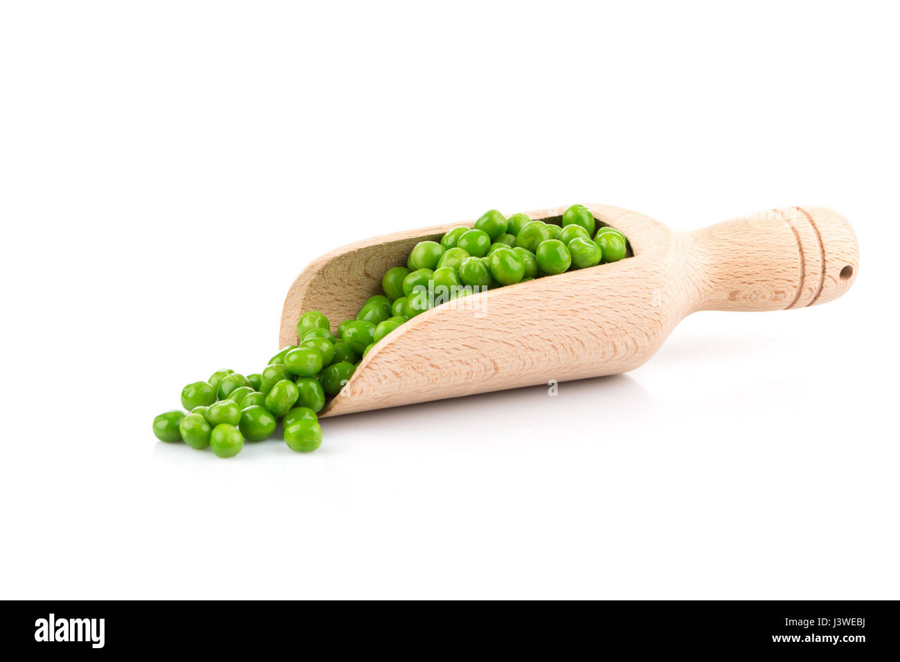 Green wet raw peas vegetable in scoop on white background Stock Photo ...