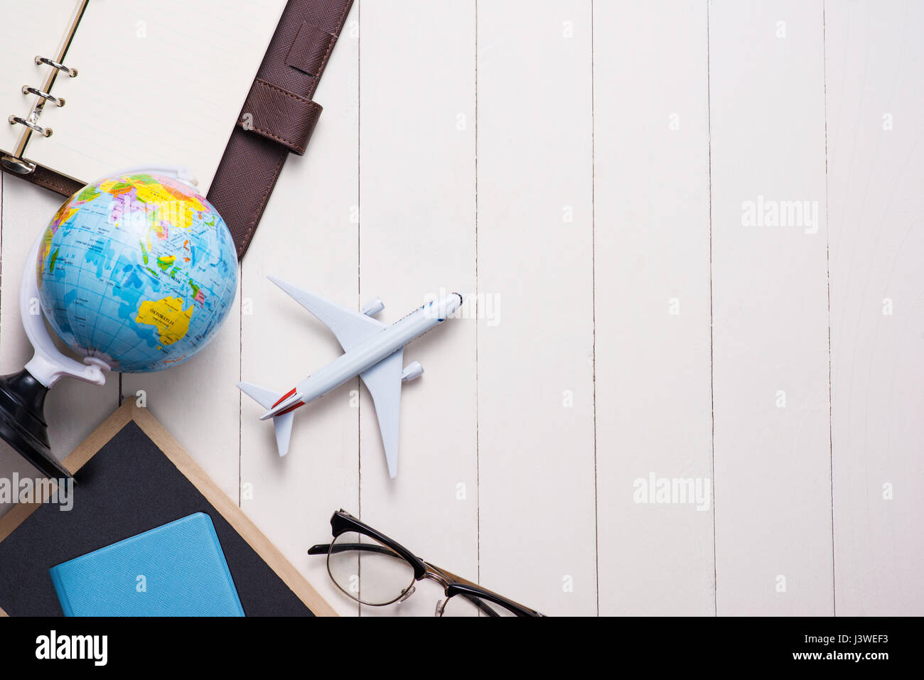 Business trip concept. Airplane and blank open notebook for your text ...