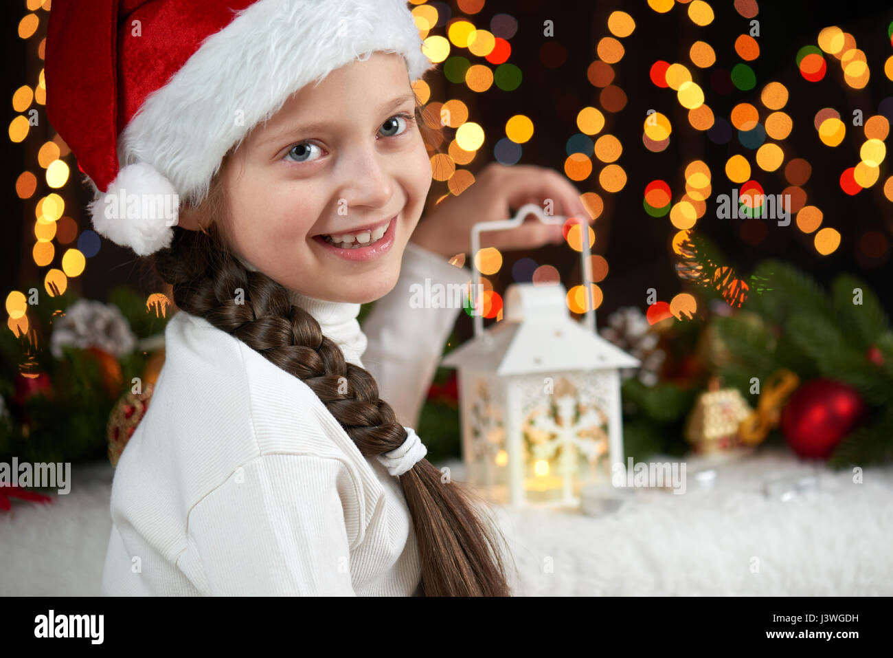 child girl portrait with christmas decoration, dark background with ...