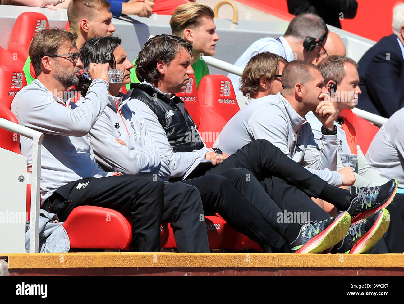 Liverpool manager Jurgen Klopp and his staff in the dugout during the ...
