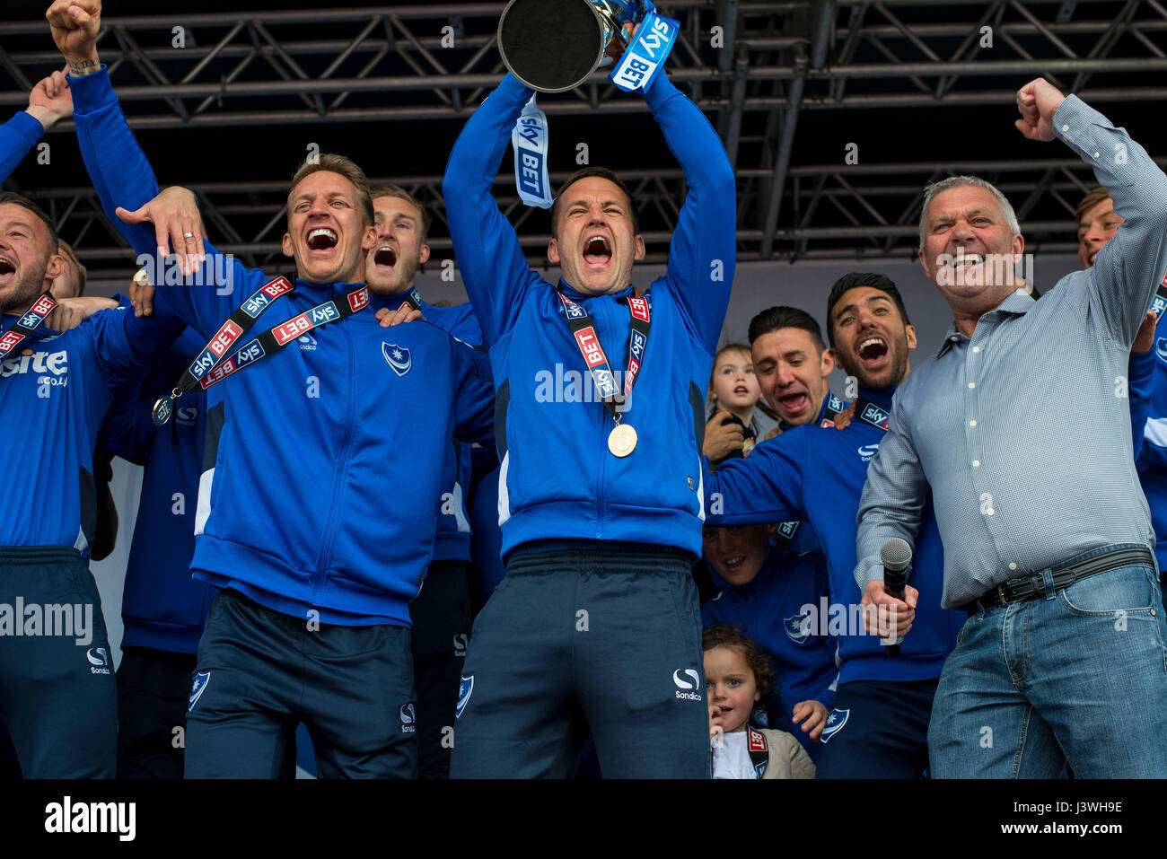 Portsmouth captain Michael Doyle lifts the League Two trophy during the ...