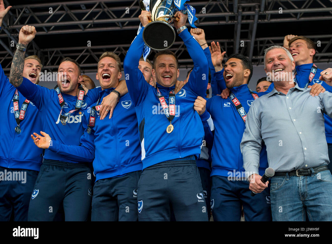 Portsmouth captain Michael Doyle lifts the League Two trophy during the ...