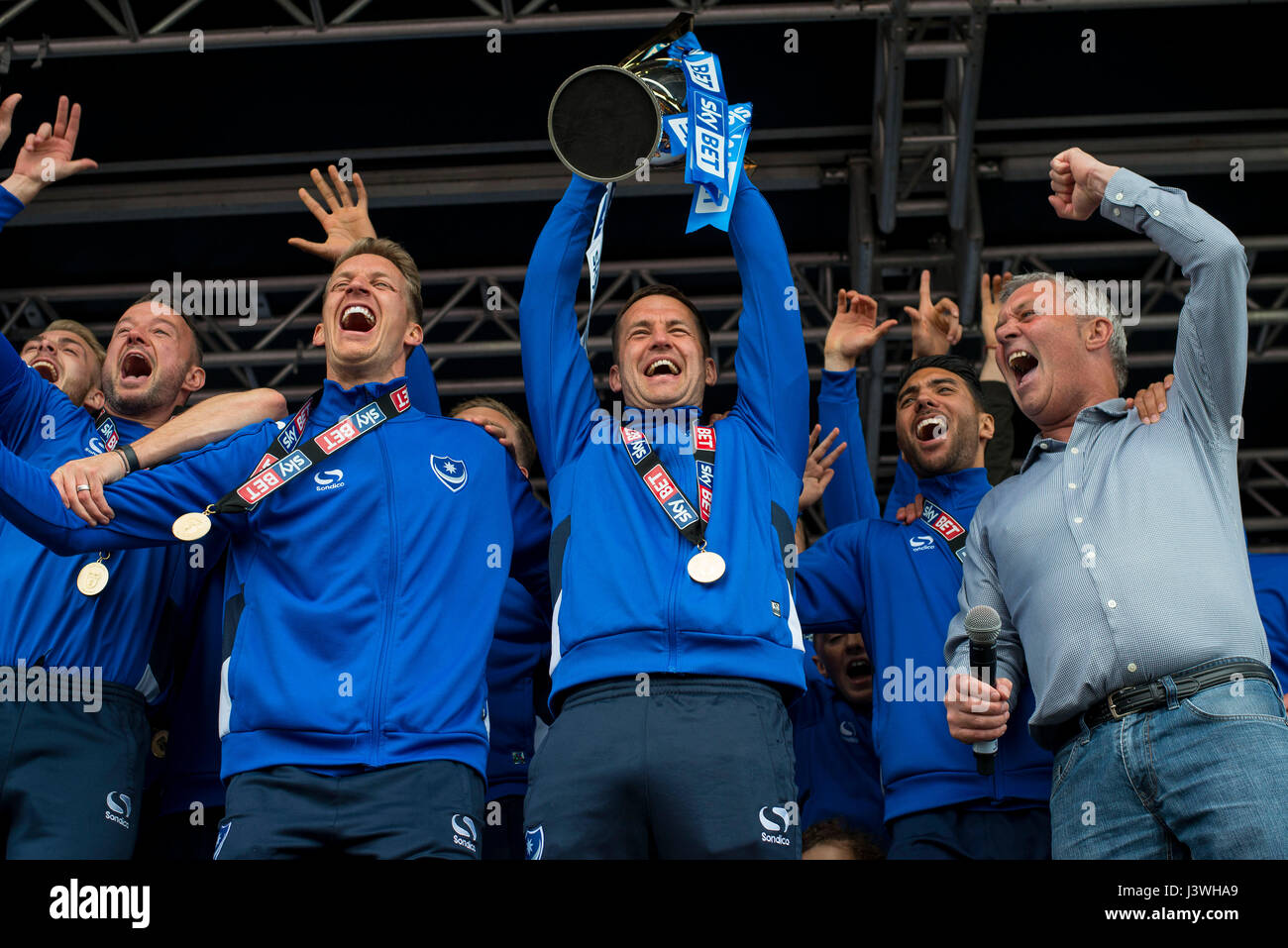 Portsmouth captain Michael Doyle lifts the League Two trophy during the ...