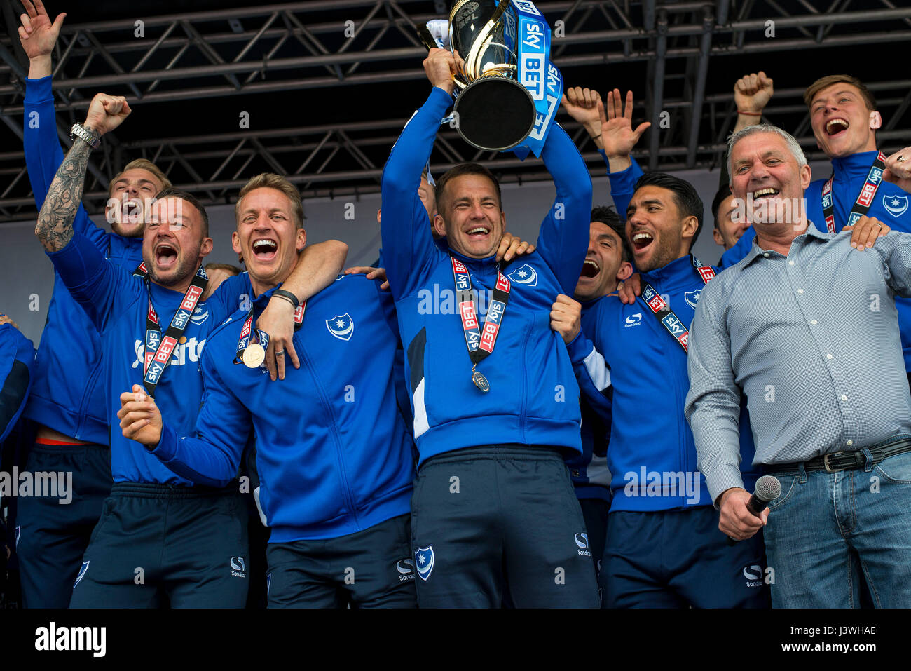 Portsmouth captain Michael Doyle lifts the League Two trophy during the ...