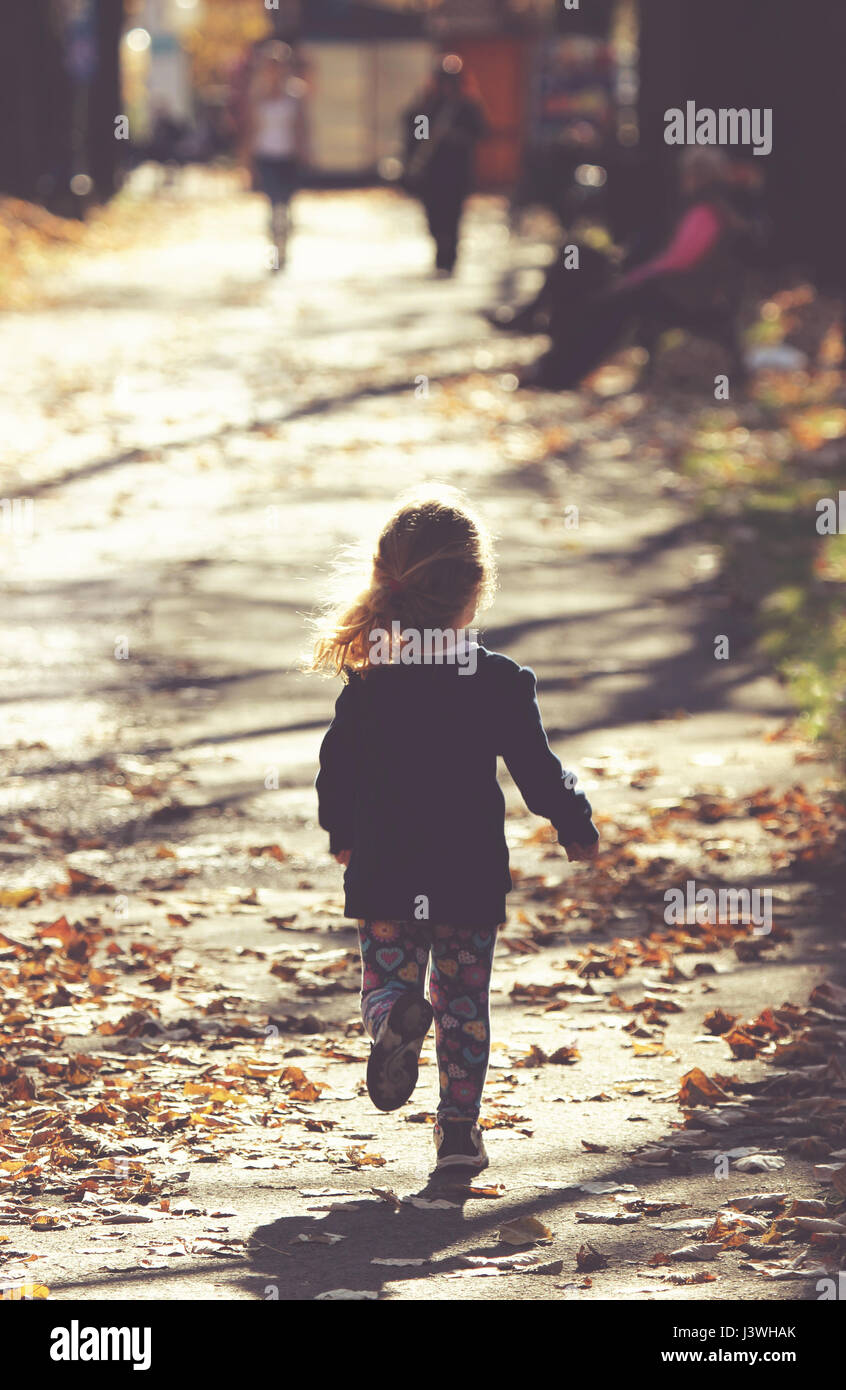 Little girl run in the park Stock Photo - Alamy
