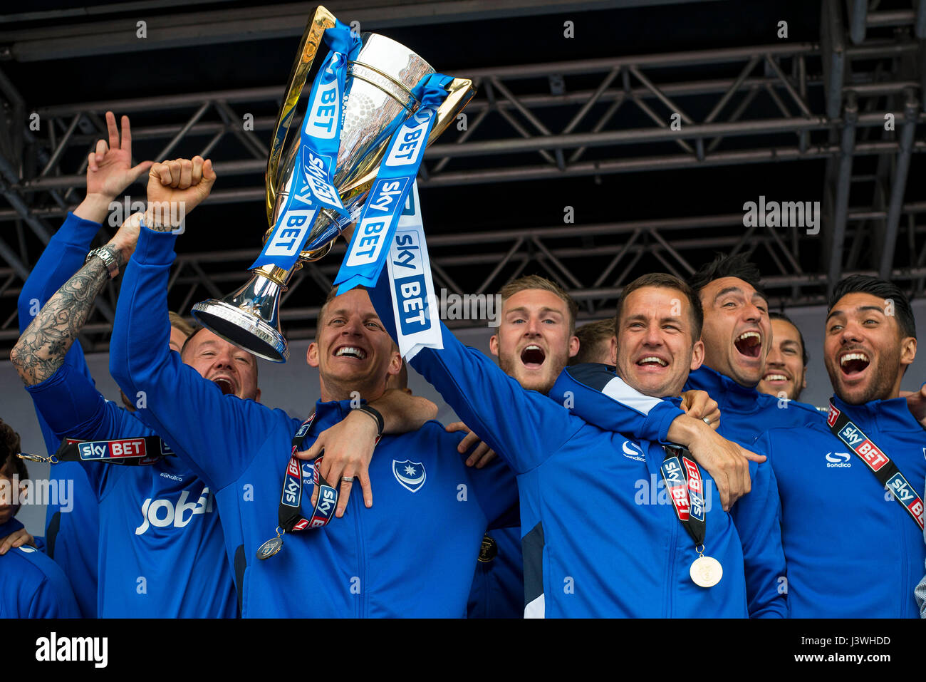 Portsmouth captain Michael Doyle lifts the League Two trophy during the ...