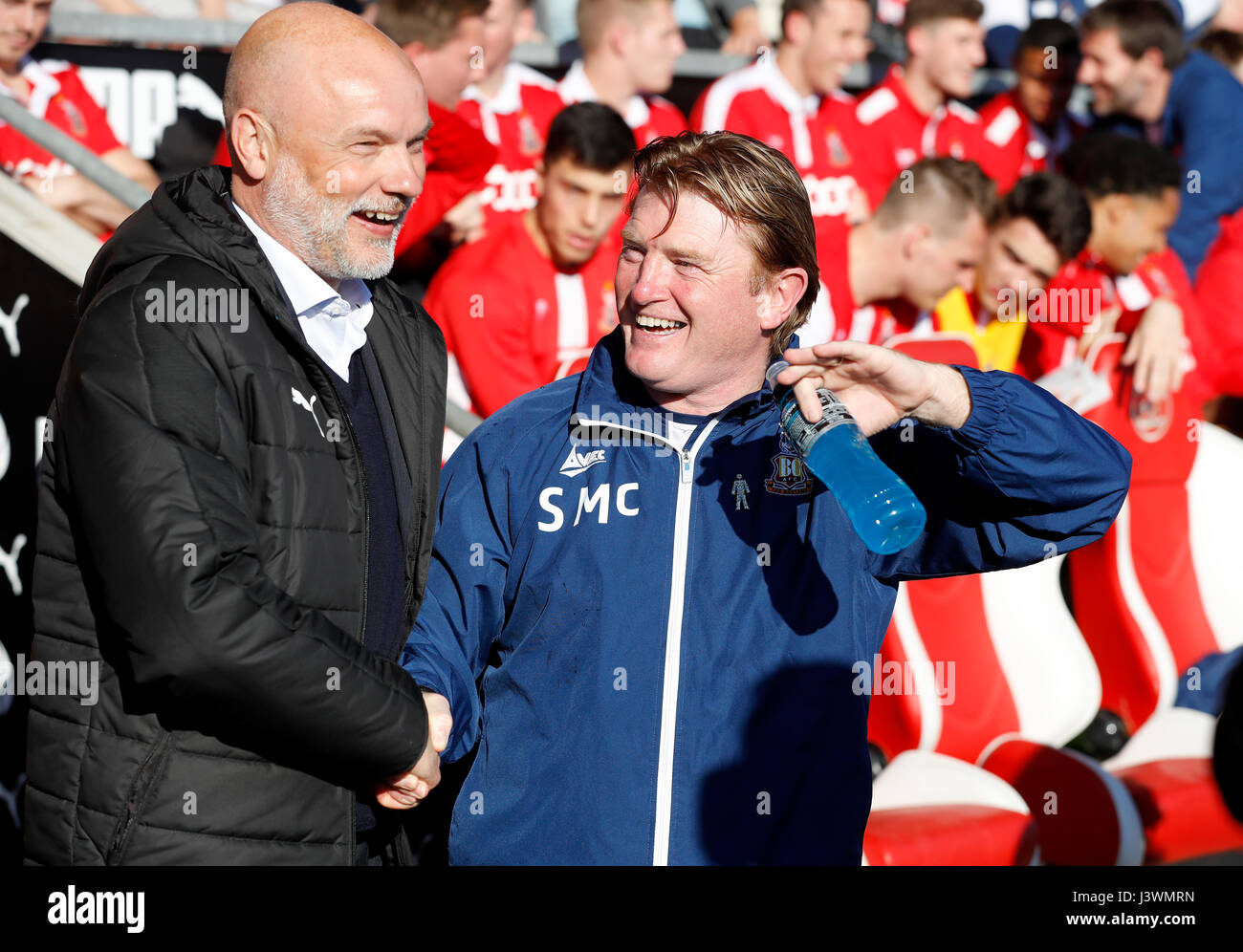 Bradford manager Stuart McCall (right) greets Fleetwood Town manager ...