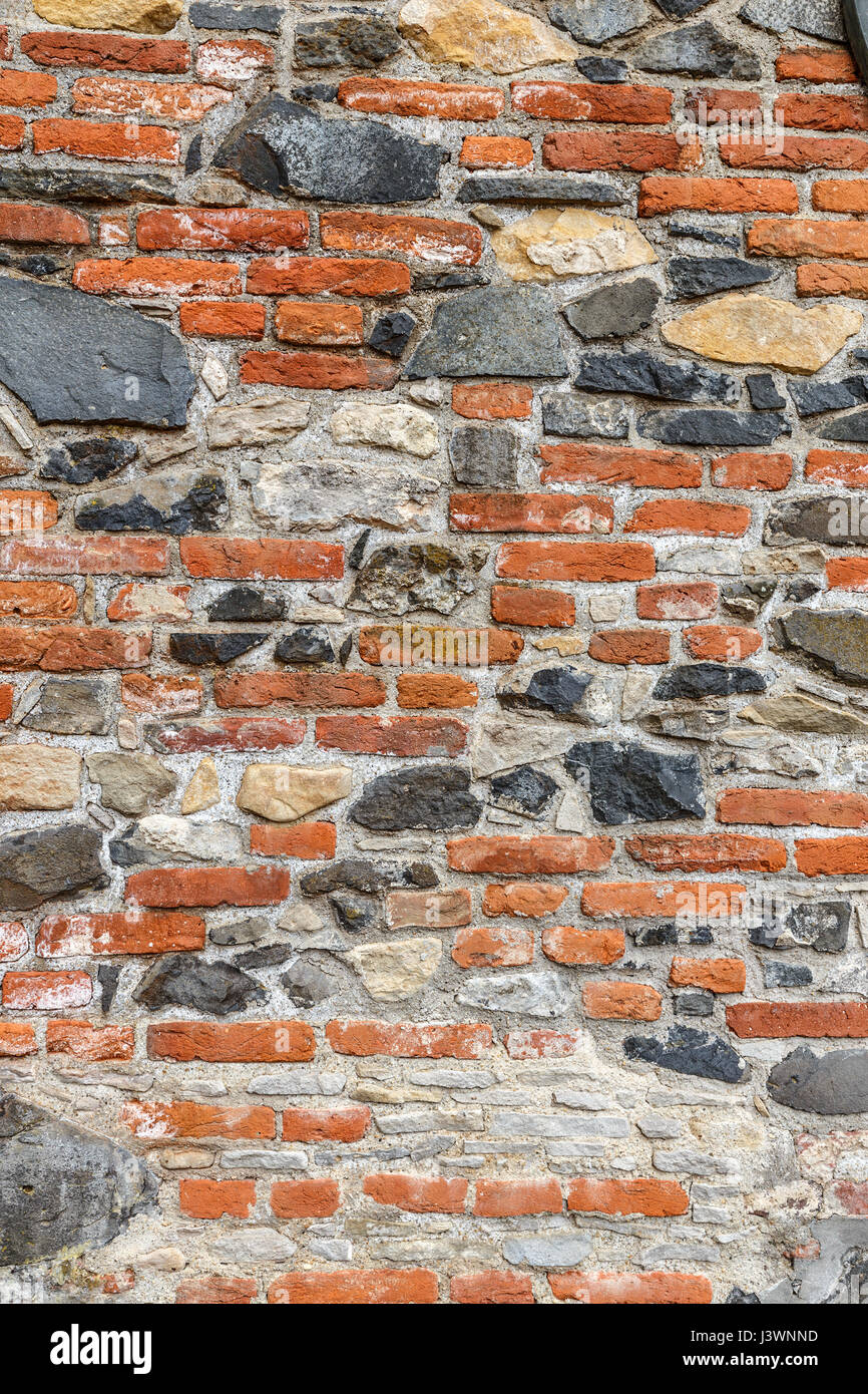 Old worn brick and stone wall texture background Stock Photo - Alamy