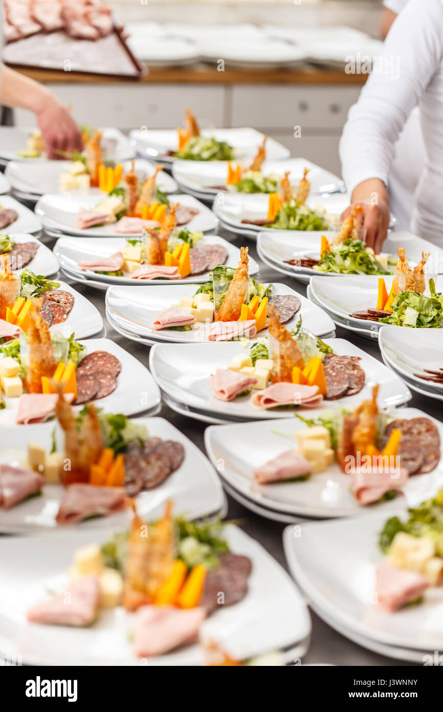 Appetizer plates in restaurant kitchen waiting for served Stock Photo ...