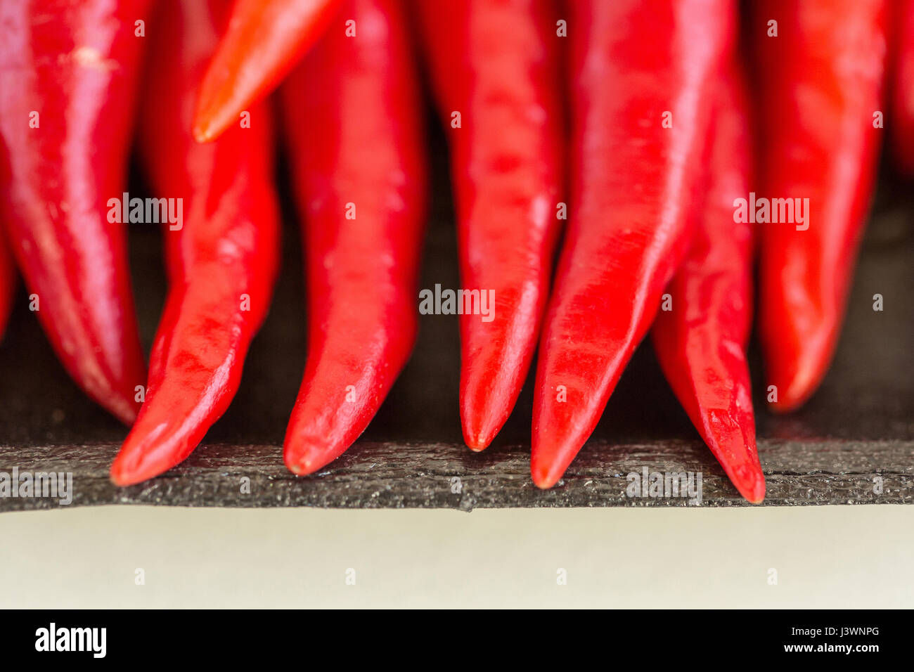 red hot chili peppers, popular spices concept - macro sharp tips of the ...