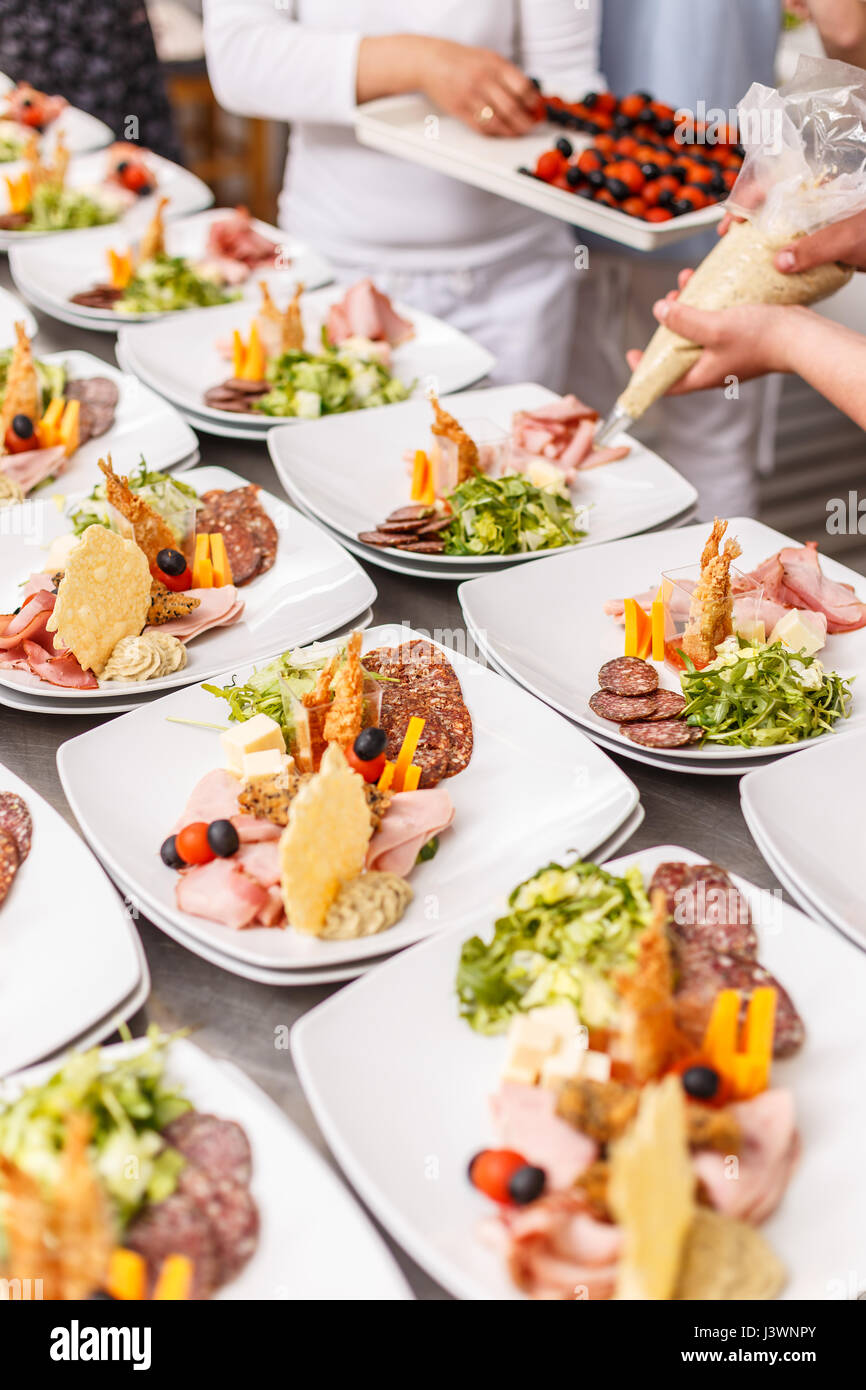 Chef is cooking set of appetizers. Catering table set service Stock ...