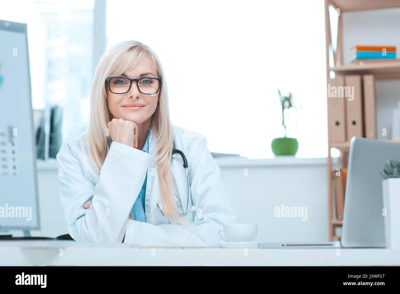 Young woman doctor occupation in the hospital office Stock Photo - Alamy
