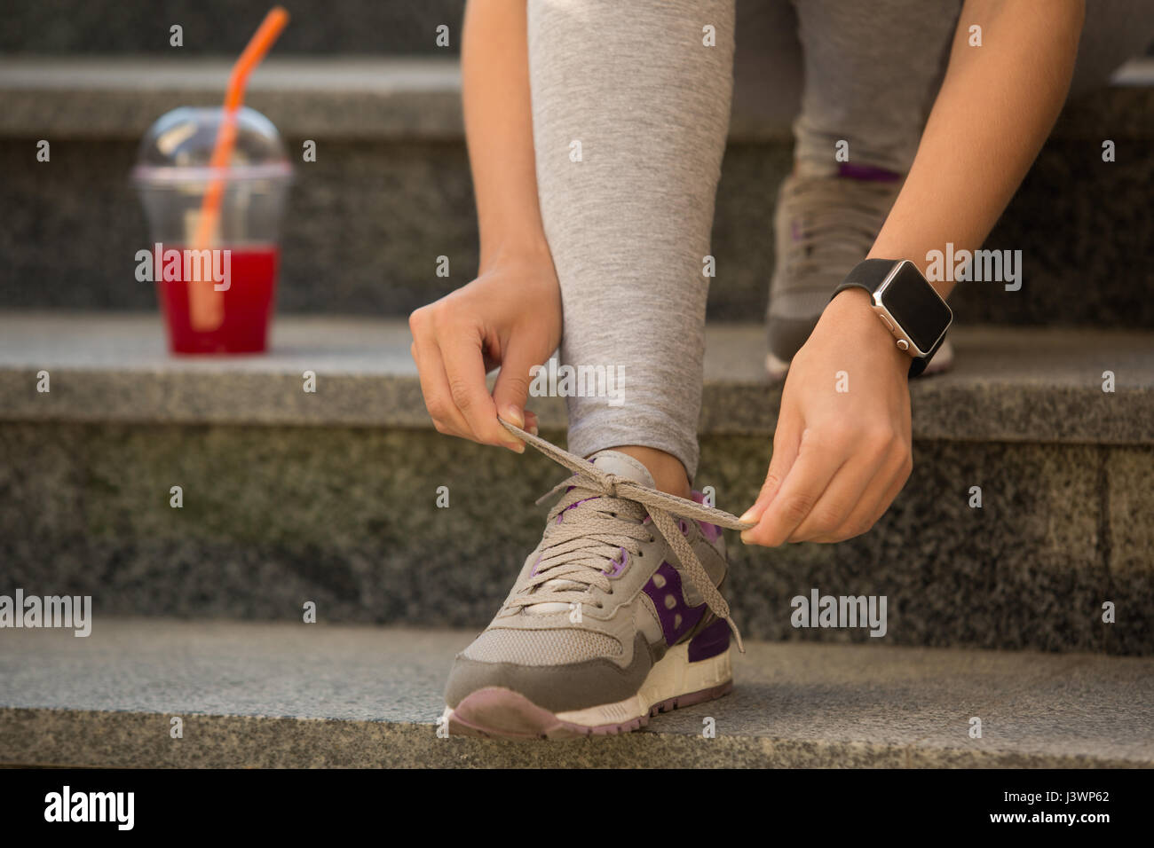Young woman lace up snickers healthy sporty lifestyle Stock Photo - Alamy