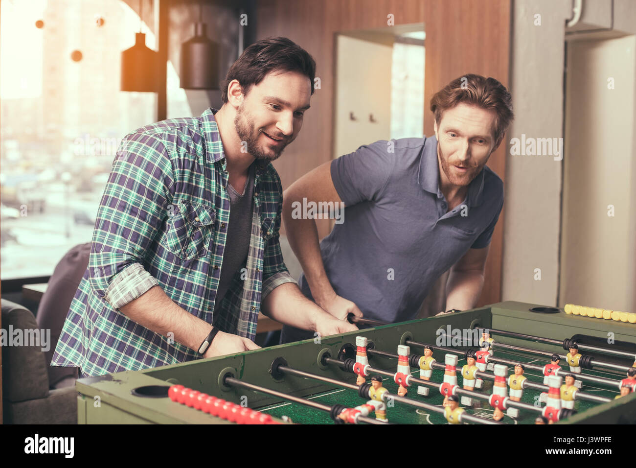 Friends having fun in pub Stock Photo - Alamy