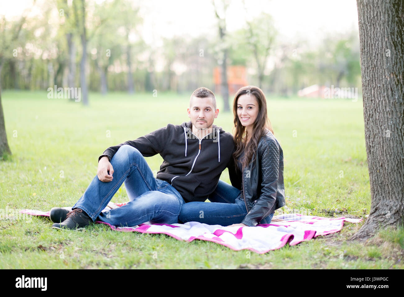 Romantic couple in park Stock Photo - Alamy