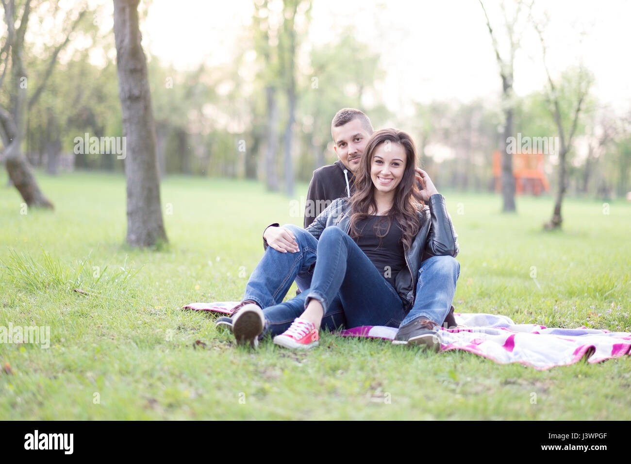 Romantic couple in park Stock Photo - Alamy