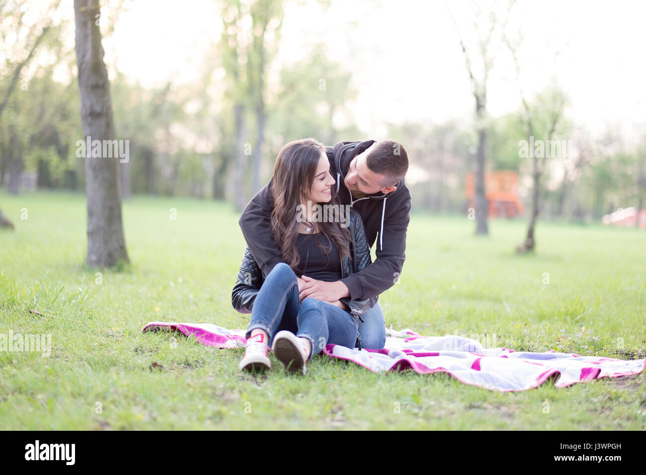 Romantic couple in park Stock Photo - Alamy
