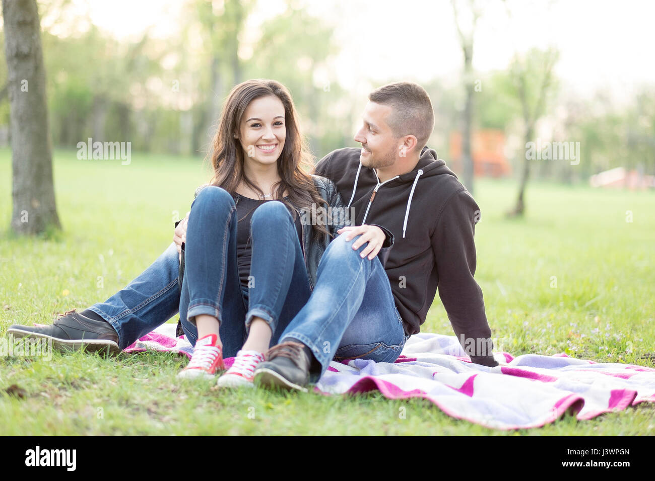 Romantic couple in park Stock Photo - Alamy