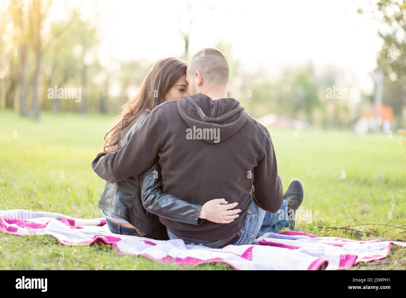 Romantic couple love in park at sunset Stock Photo - Alamy