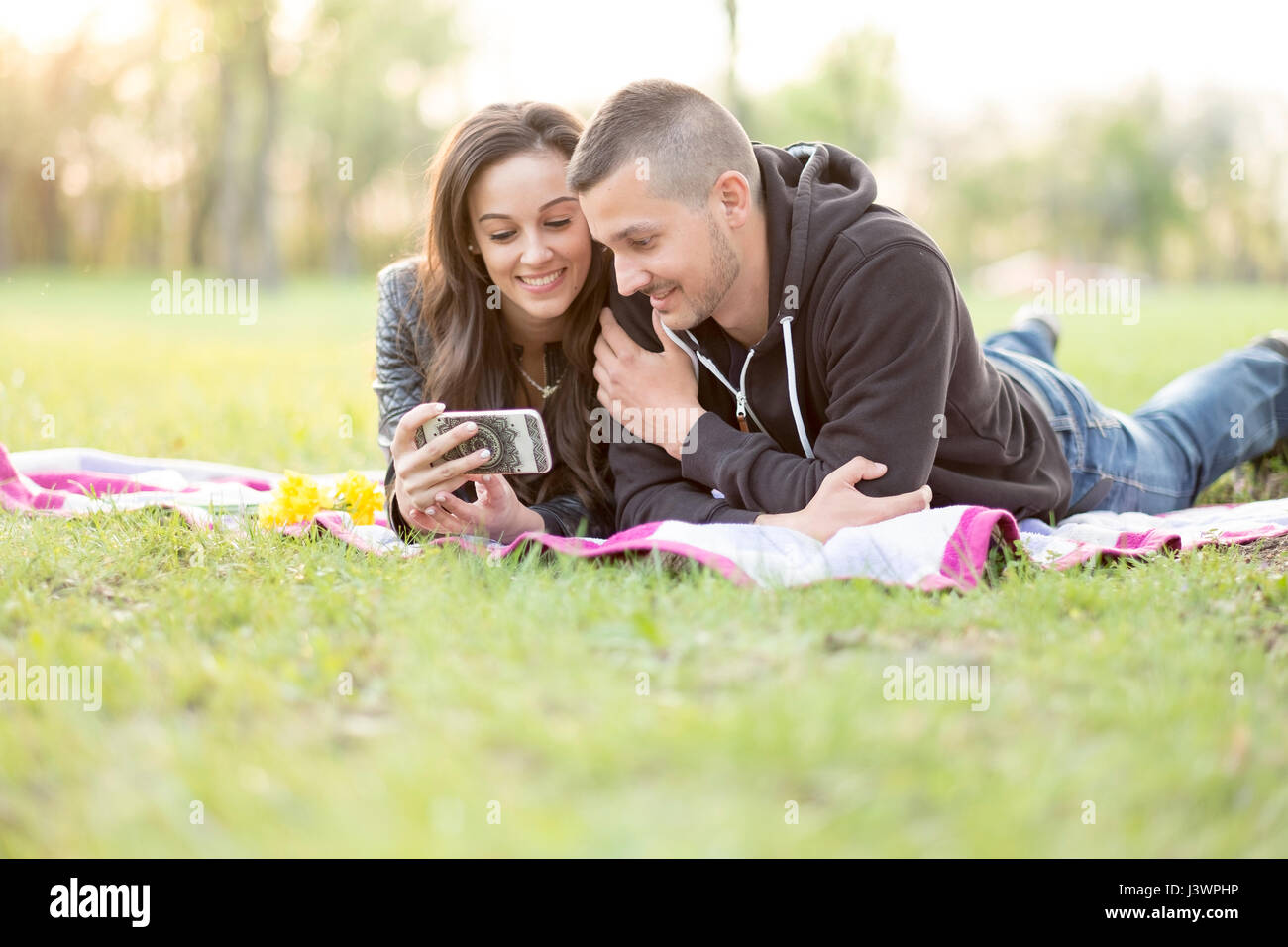 Romantic couple love in park at sunset Stock Photo - Alamy