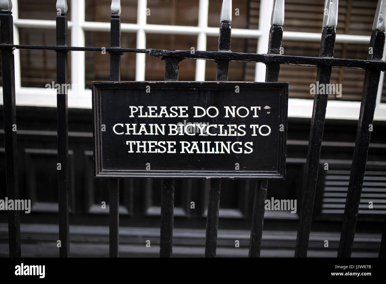 Sign on railings saying 'Please Do Not Chain Bicycles To These Railings ...