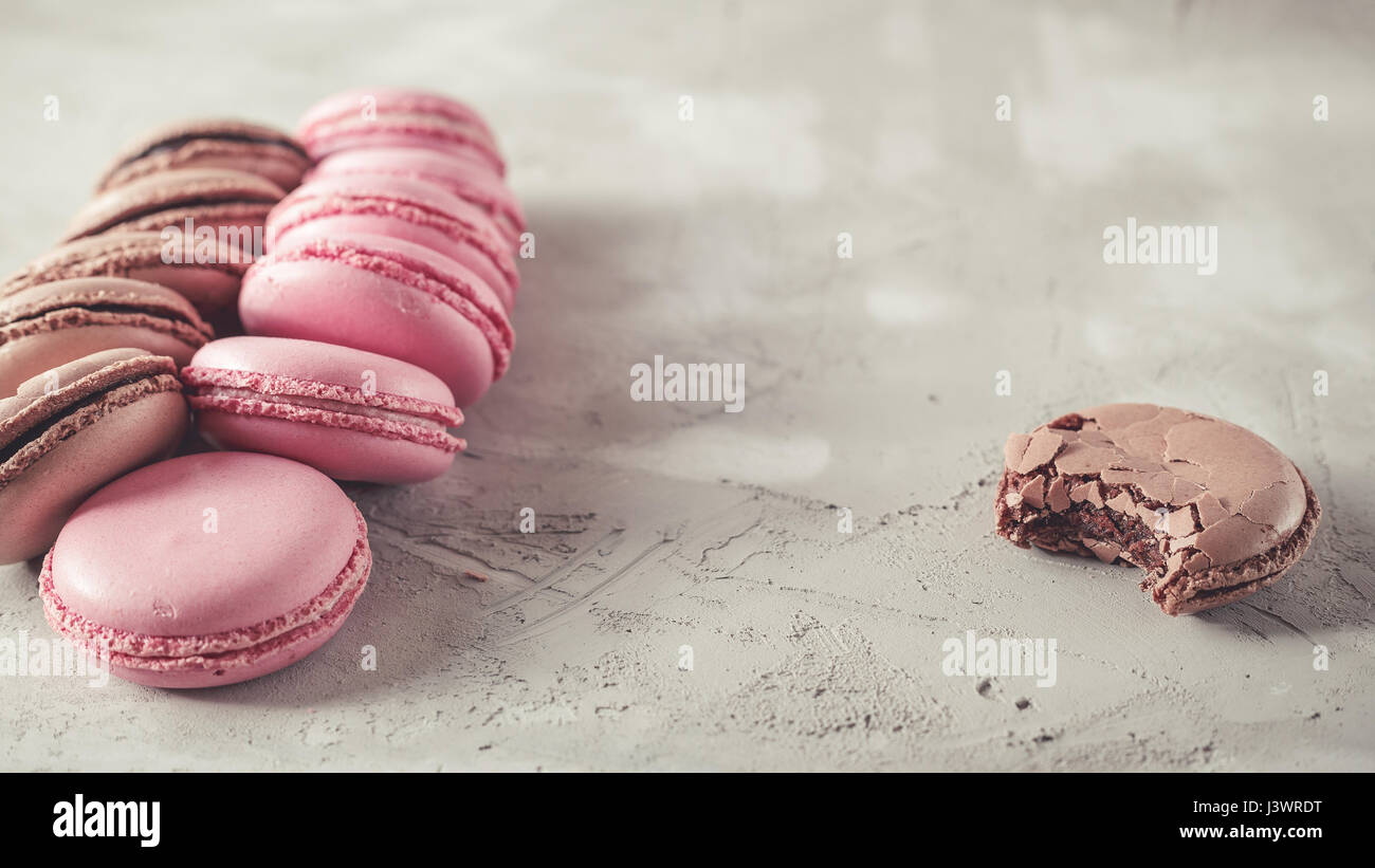 Raspberry and Chocolate pastel colored Macarons or Macaroons over ...