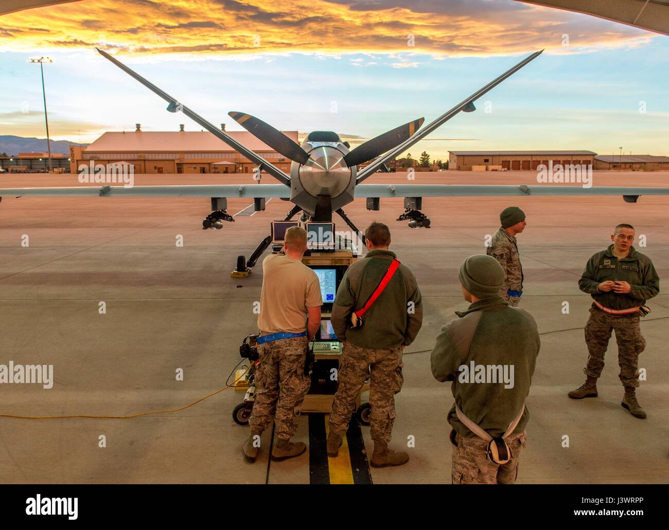 U.S. soldiers perform a post-flight check on a USAF MQ-9 Reaper ...