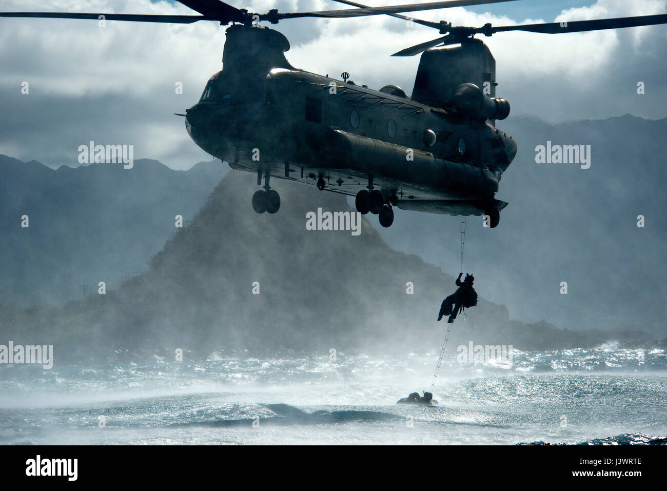 A USAF special operations airman climbs up an assault ladder onto a U.S ...