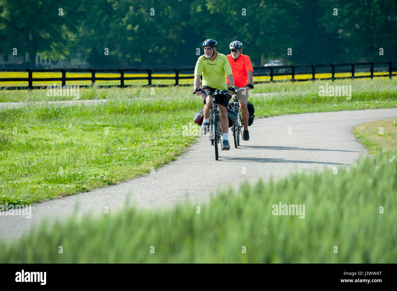 USA Virginia VA Jamestown two men cyclists riding on the Virginia ...